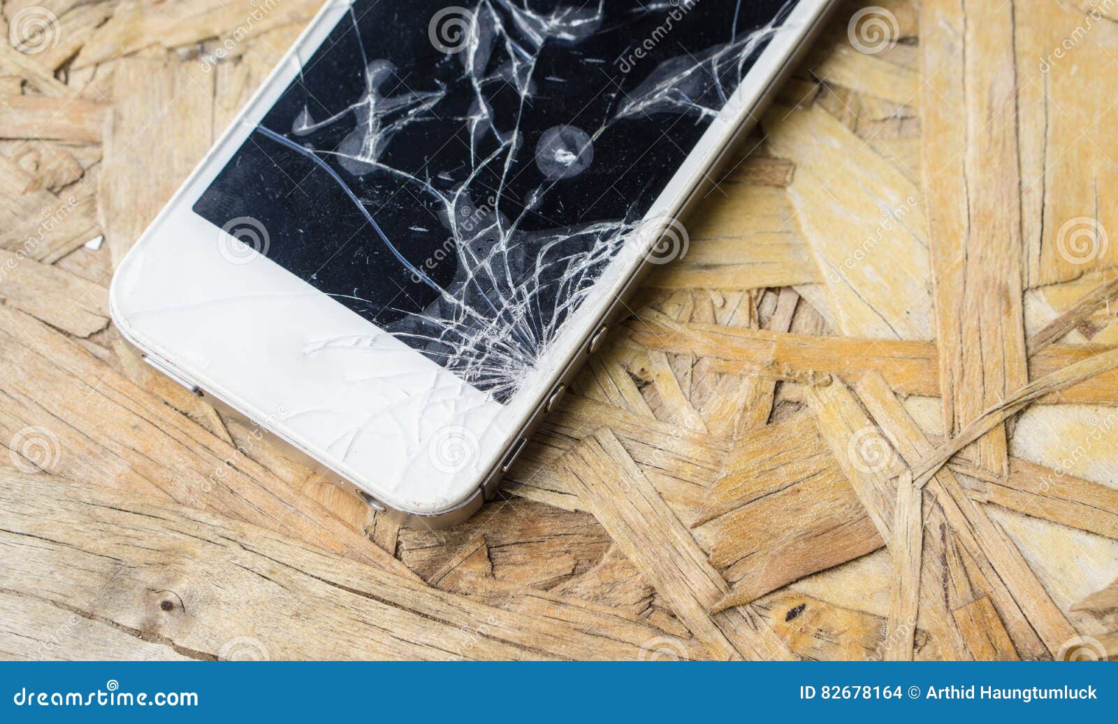Broken phone on wood desk stock photo. Image of ground - 82678164