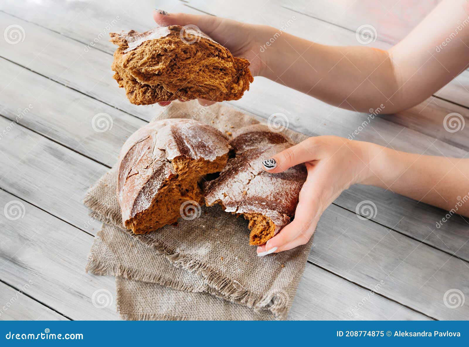 Broken into Pieces Round Fresh Grain Dark Bread in Hands of ...