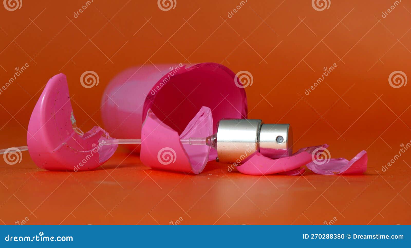 Broken Pink Perfume Bottle on Orange Background Stock Photo - Image of ...