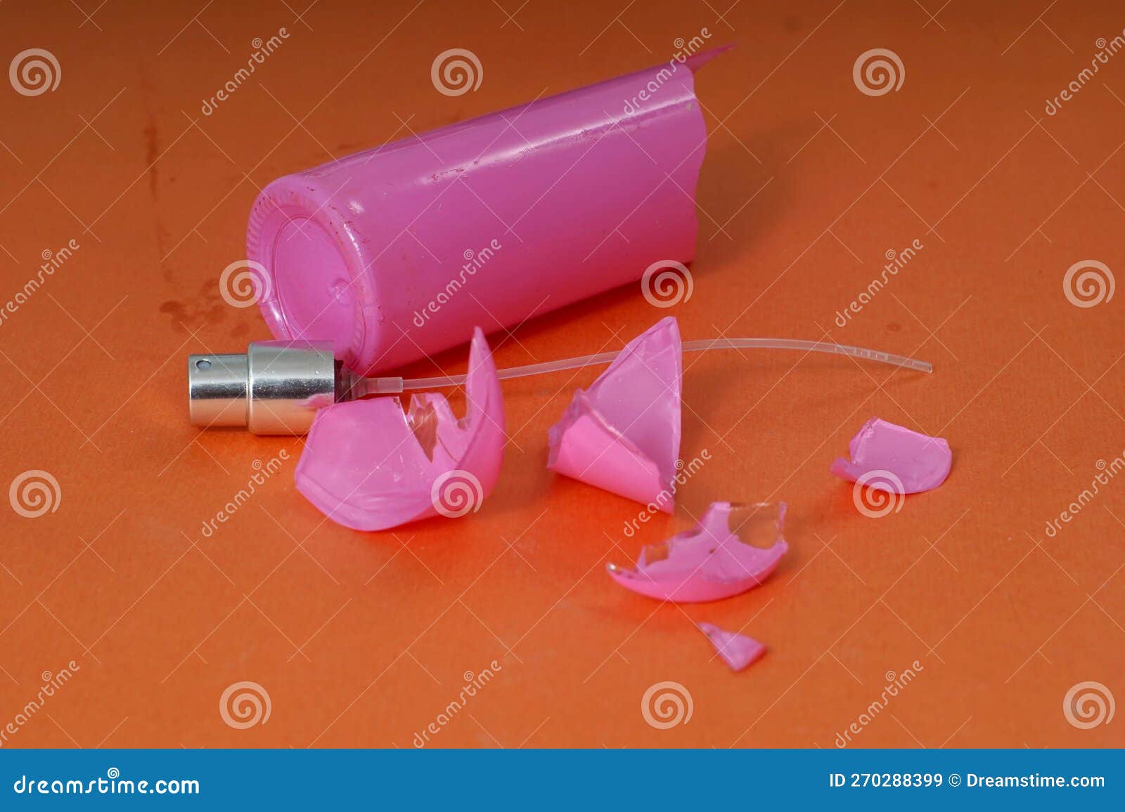 Broken Pink Perfume Bottle on Orange Background Stock Image - Image of ...