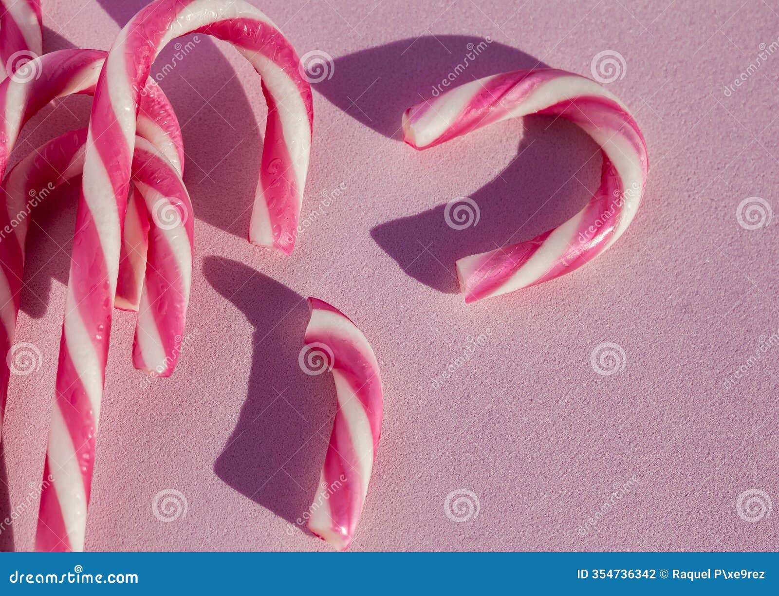 Broken Pink and White Candy Canes on a Pastel Pink Background Stock ...