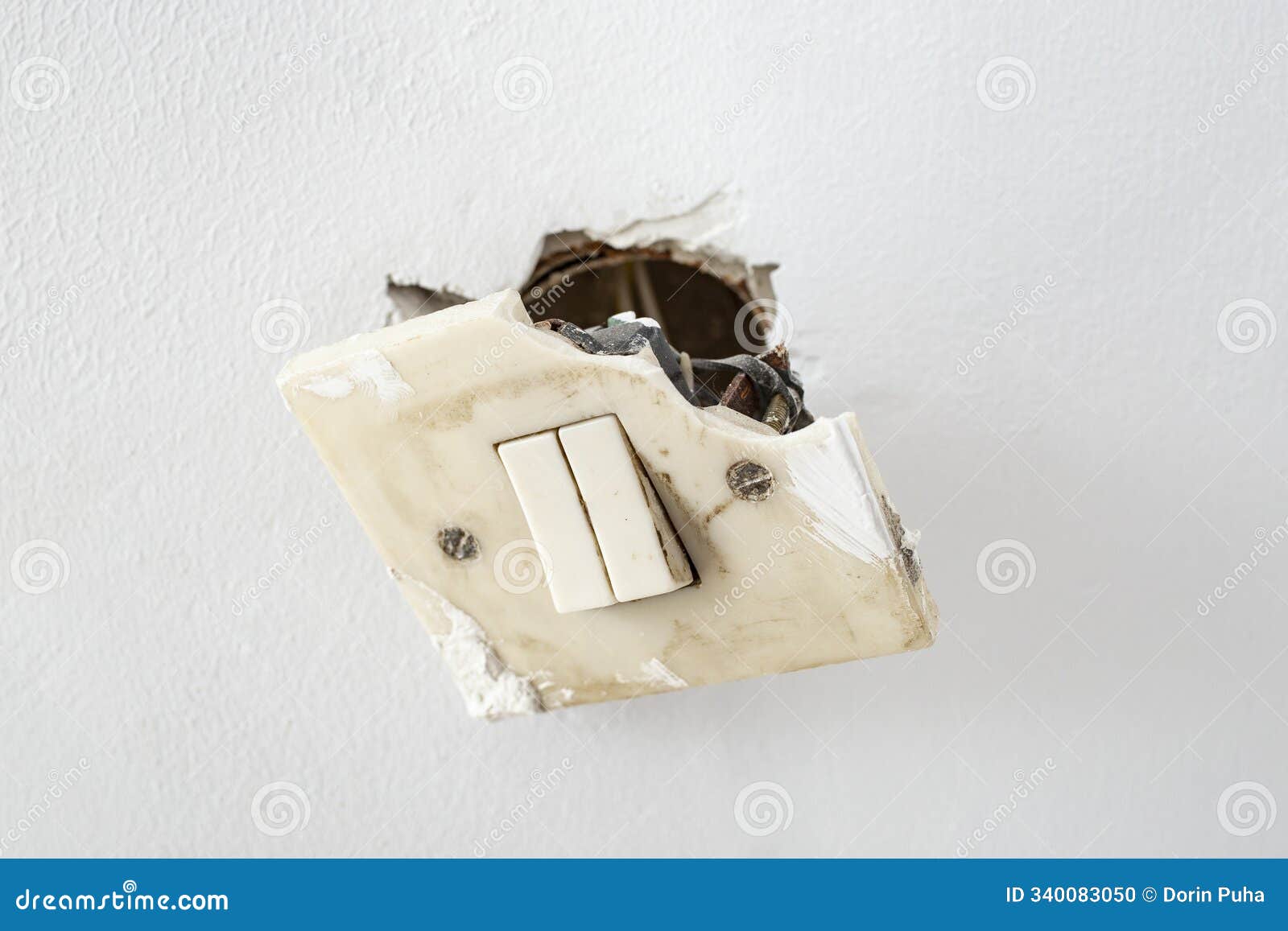 Broken Plastic Light Switch Ripped from a Whjte Wall, Abstract ...