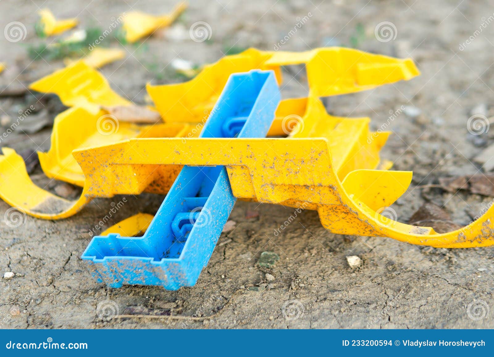 A Broken Plastic Toy Lies on the Ground. Broken Car without Wheels ...