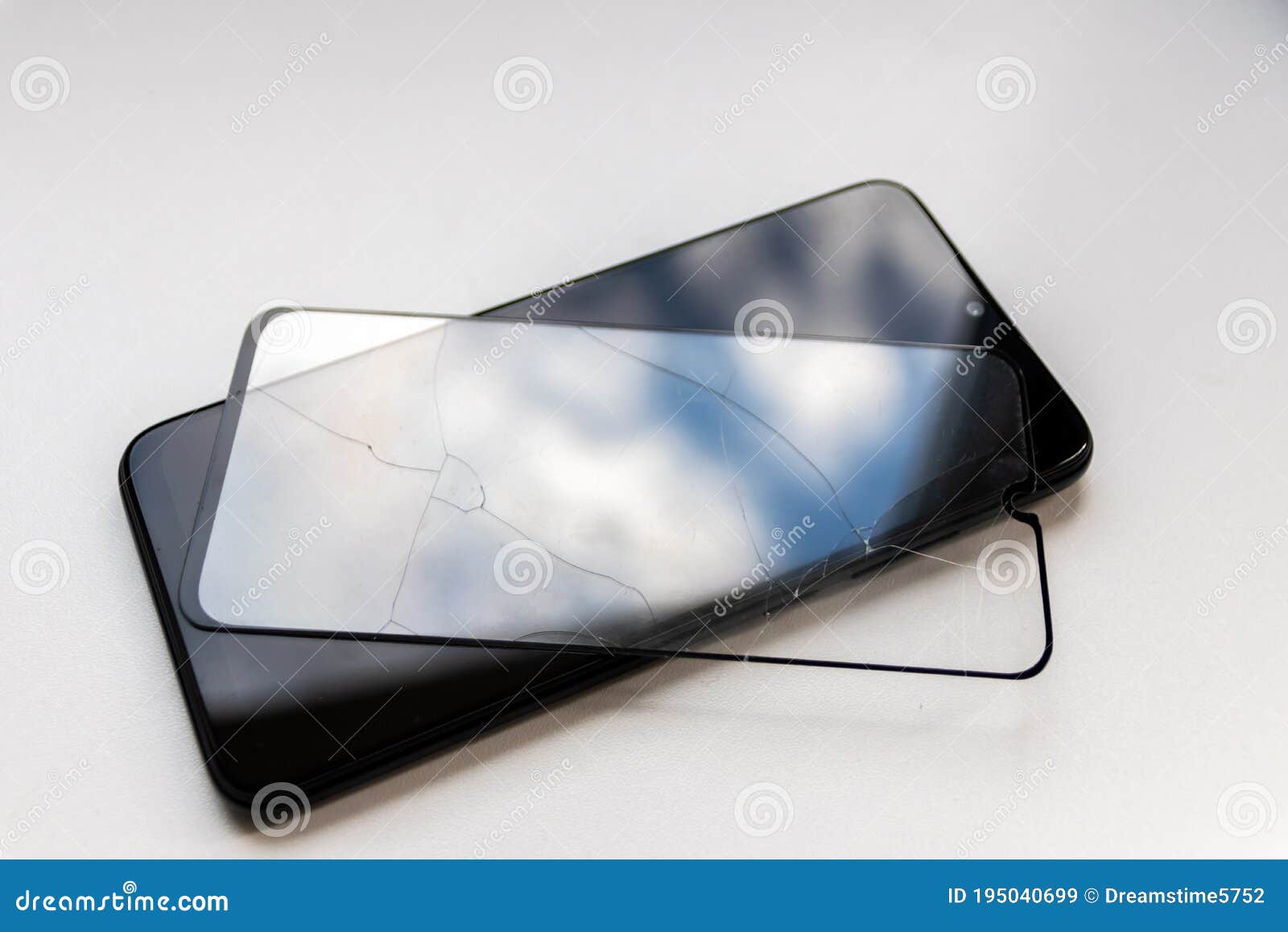 Broken Protective Shield on a Black Smartphone Shows Display Protection ...
