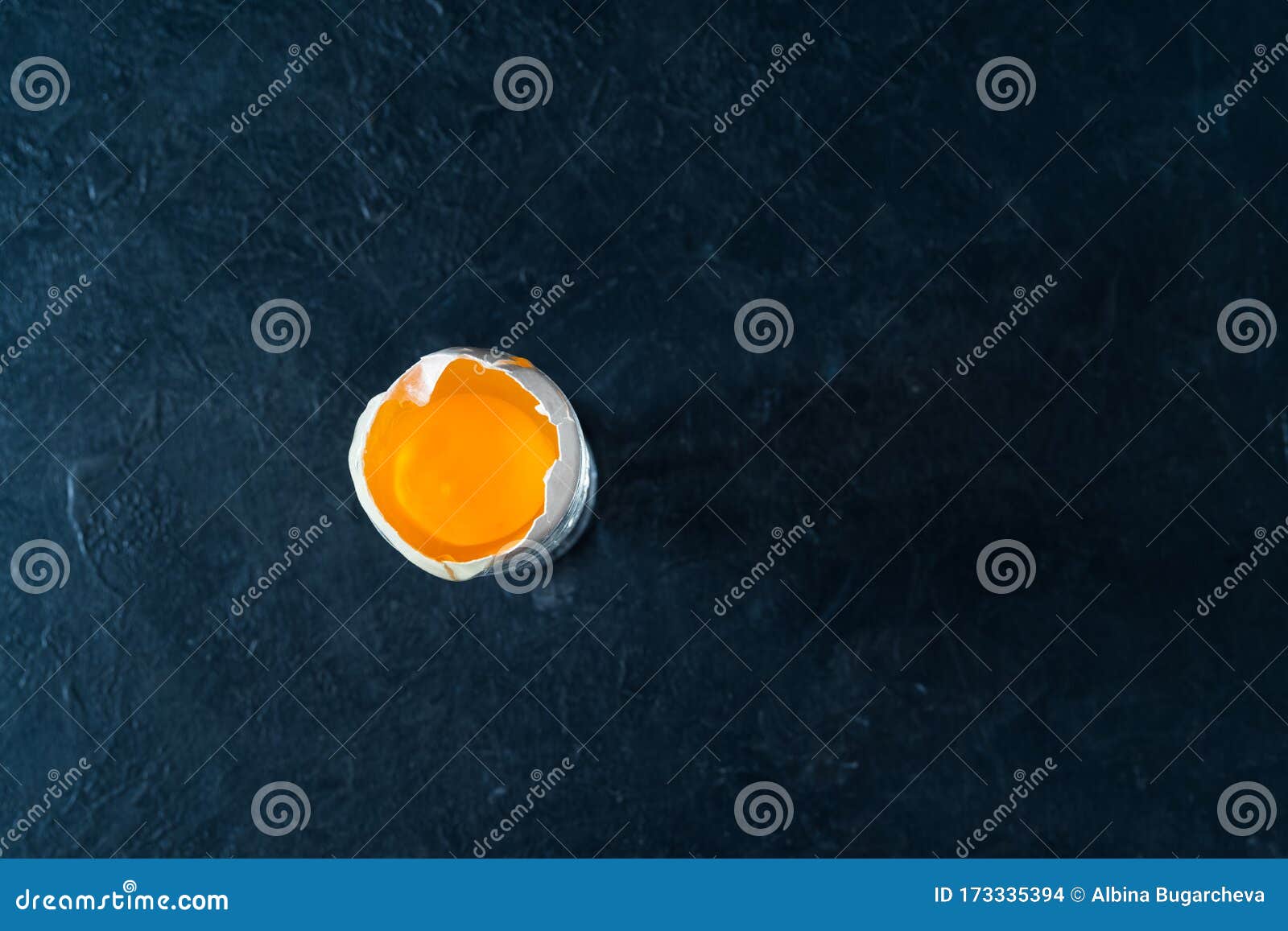 Broken Raw Egg with Yolk on Dark Blue Background, Top View Stock Photo ... Broken Raw Egg with Yolk on Dark Blue Background, Top View Stock Photo ...