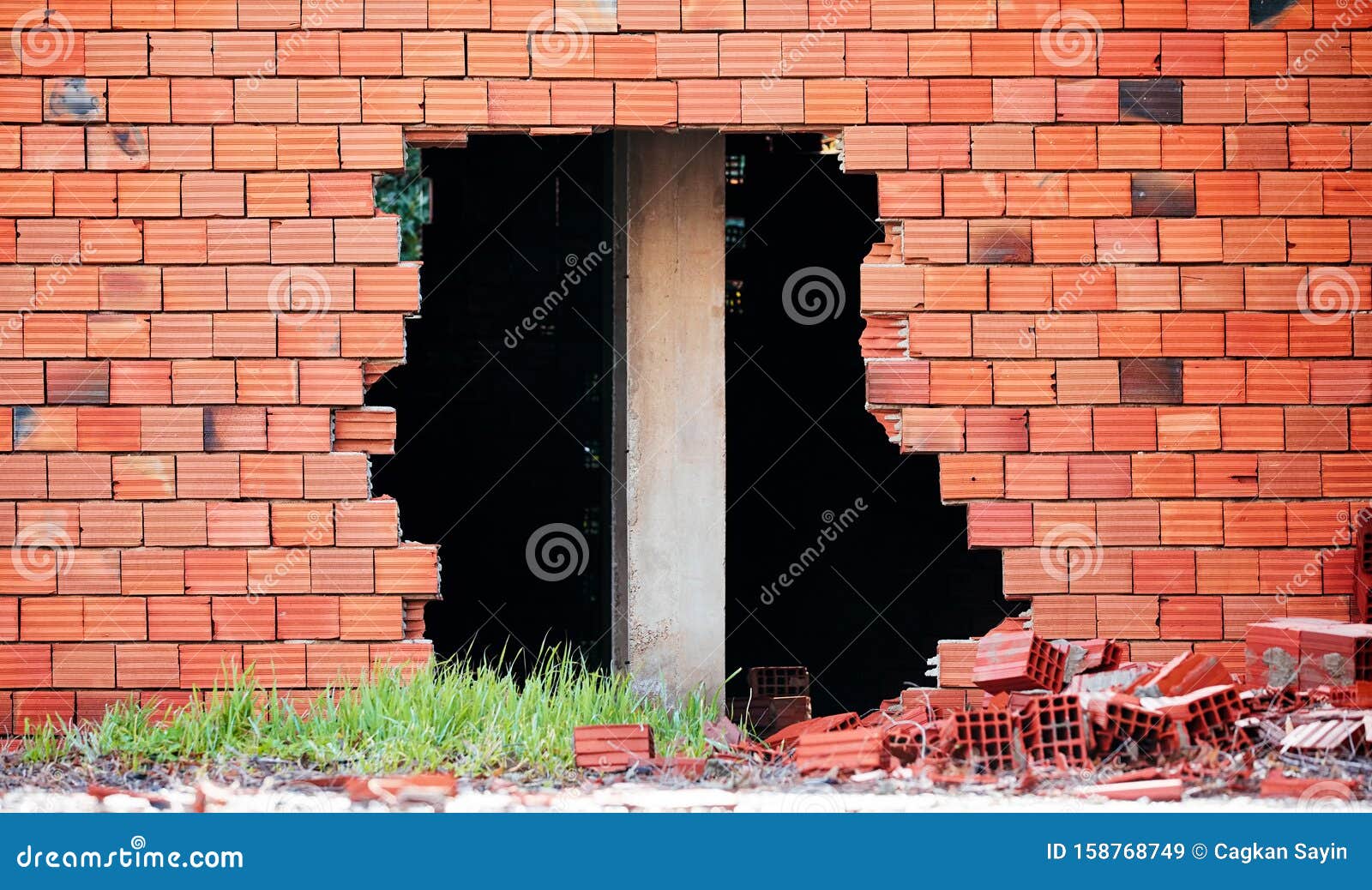 Broken Red Brick Wall with a Big Hole and a Construction Column Pillar ...