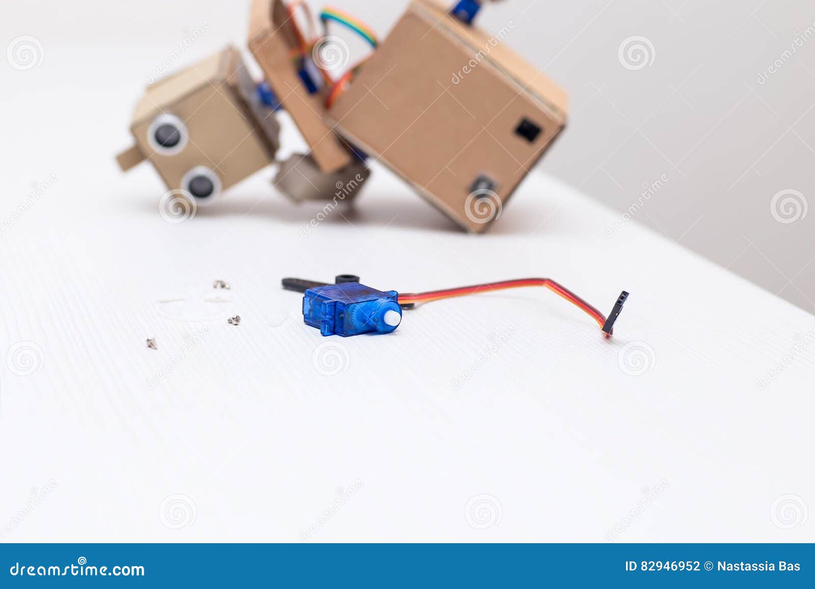 Broken Robot Lying on the White Table, Spare Parts Stock Photo - Image ...