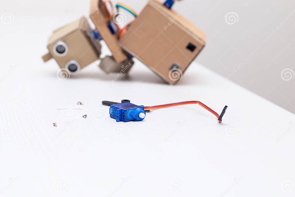 Broken Robot Lying on the White Table, Spare Parts Stock Photo - Image ...