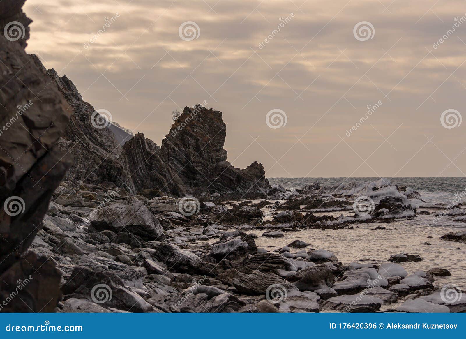 Icy Sharp Rocks in a Cold Sea Stock Photo - Image of rocks, cold: 176420396