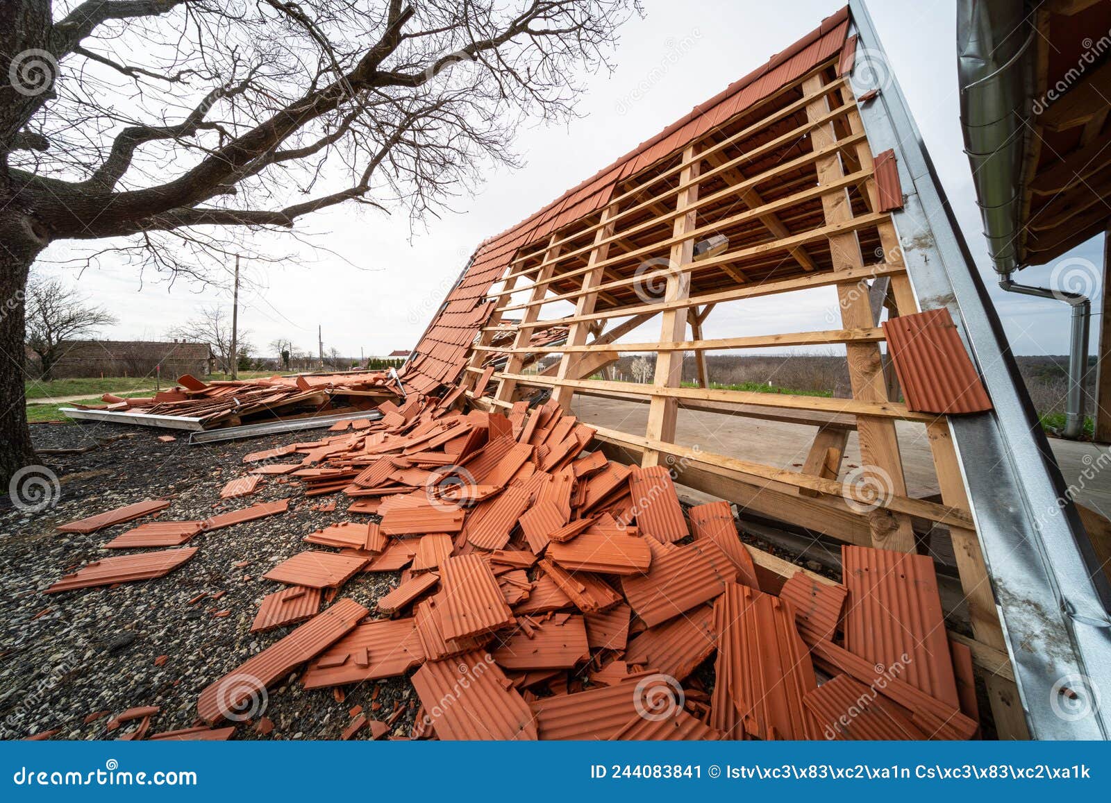 Broken roof after a storm stock image. Image of climate - 244083841