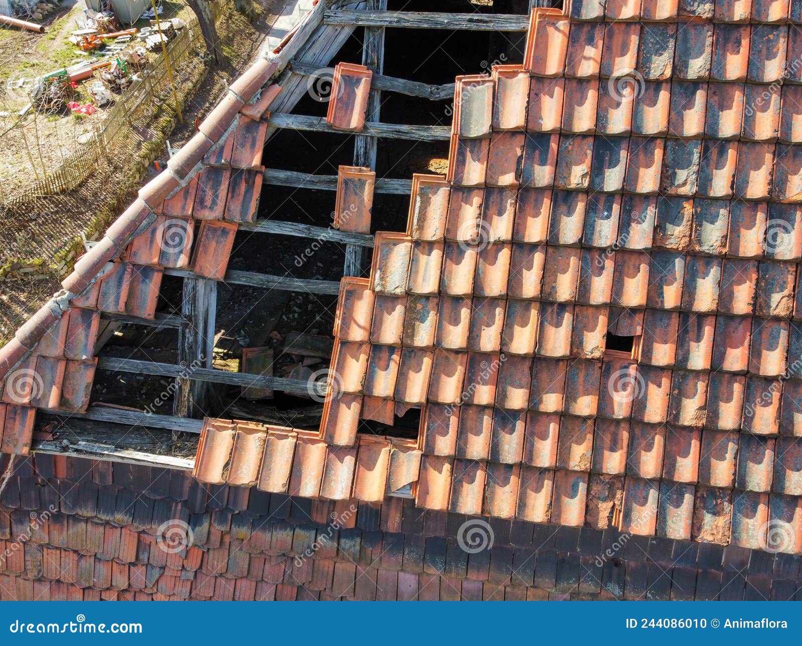 Broken roof after a storm stock photo. Image of demolition - 244086010