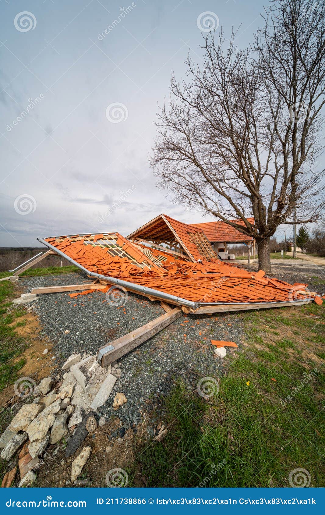 Broken roof after a storm stock photo. Image of destruction - 211738866
