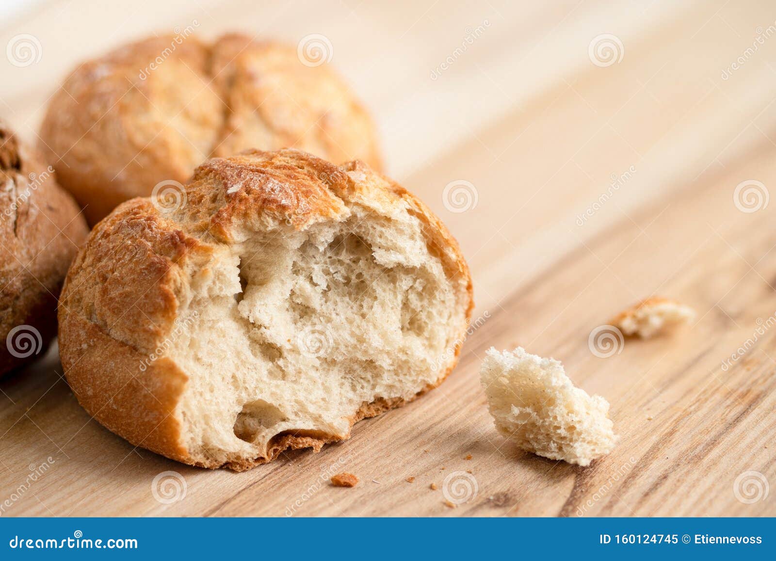 Broken Round Rustic White Bread Roll Next To Two Round Bread Rolls on ...