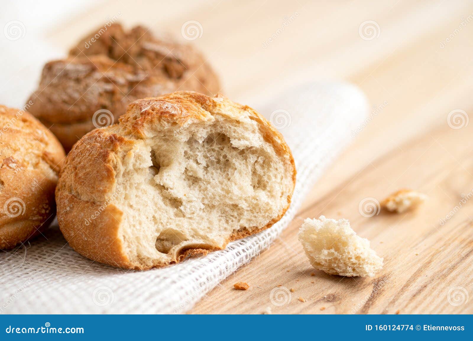 Broken Round Rustic White Bread Roll Next To Two Round Bread Rolls on ...