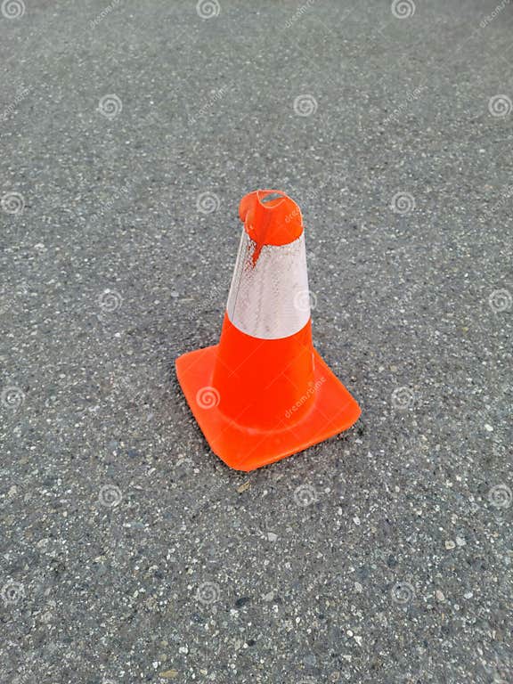 Broken Safety Cone Damaged on the Tip. Placed on Asphalt Stock Photo ...