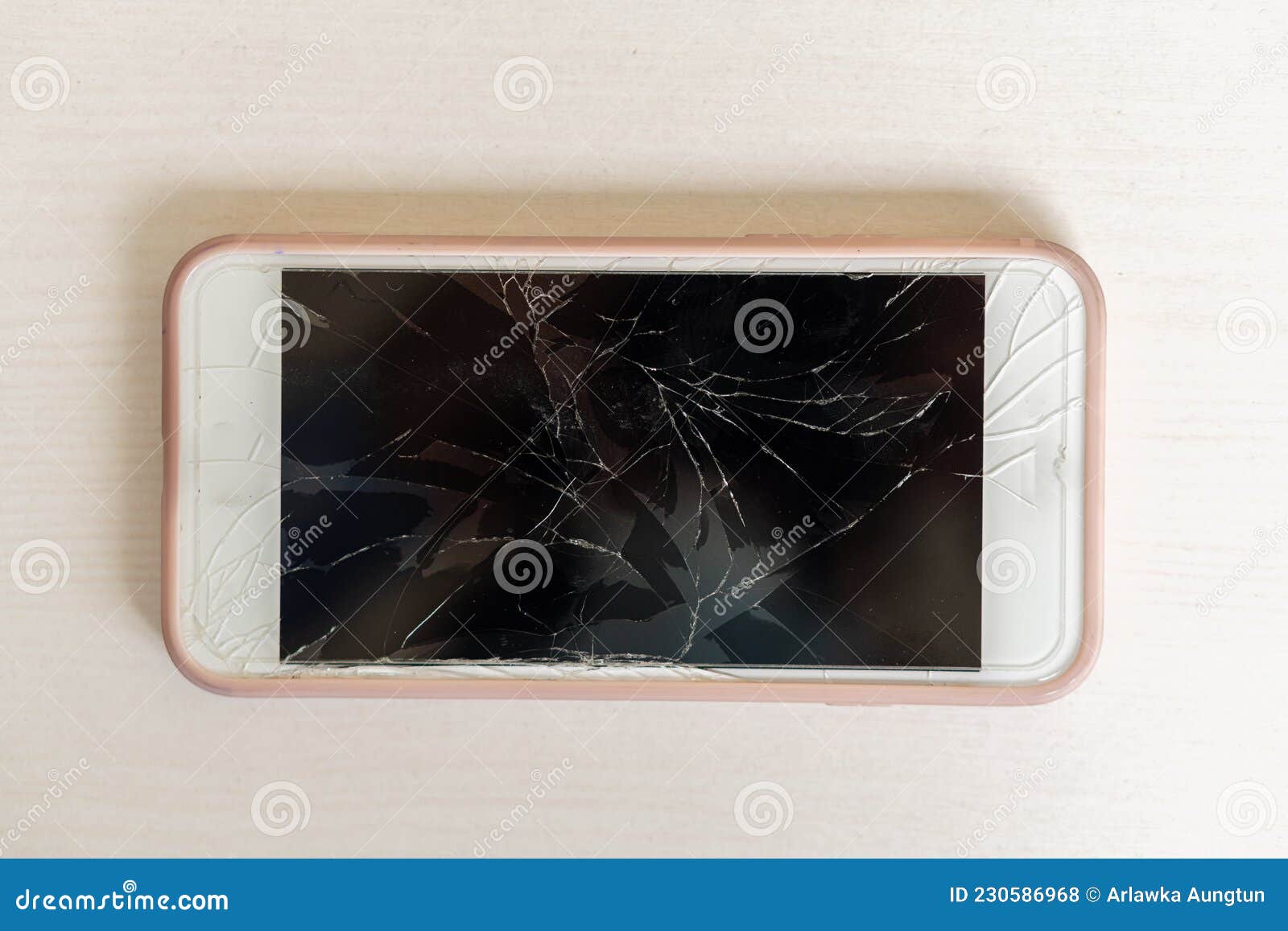 Broken Screen Smartphone Laying on a Separate White Desk, Backside ...
