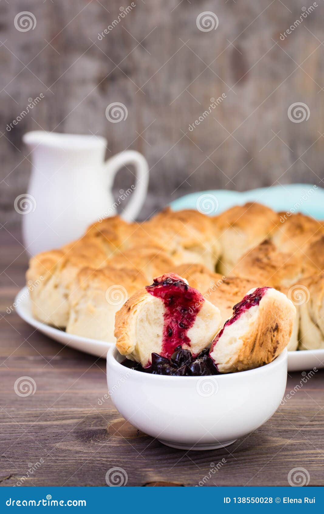 Broken Slice of Monkey Bread in Black Currant Jam in a Bowl Stock Photo ...
