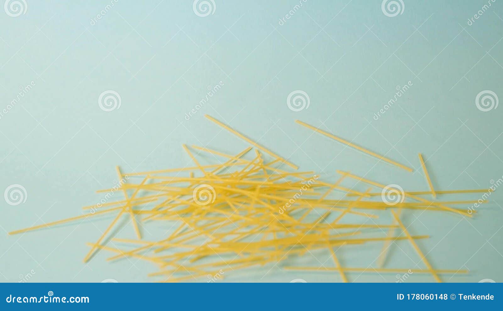 Broken Spaghetti Falling on Blue Background Stock Footage - Video of ...