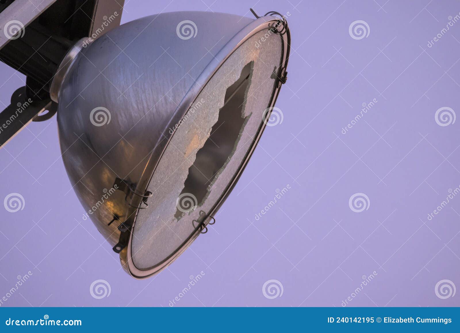 Broken Stadium Light Fixture with a Baseball Sized Hole in the Diffuser ...