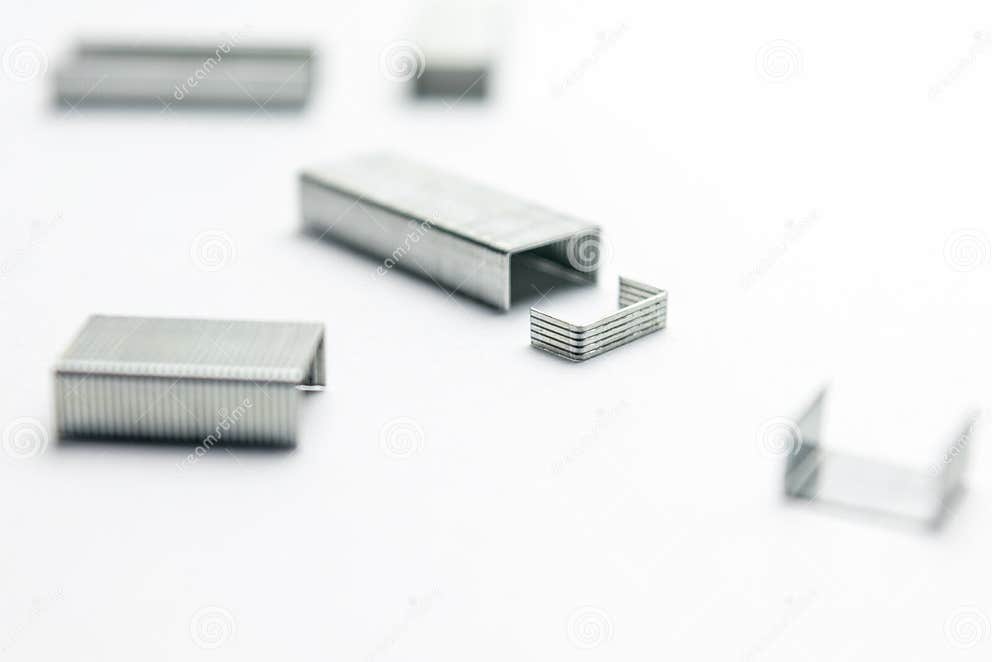 Broken staples on paper stock image. Image of abstract - 84070481