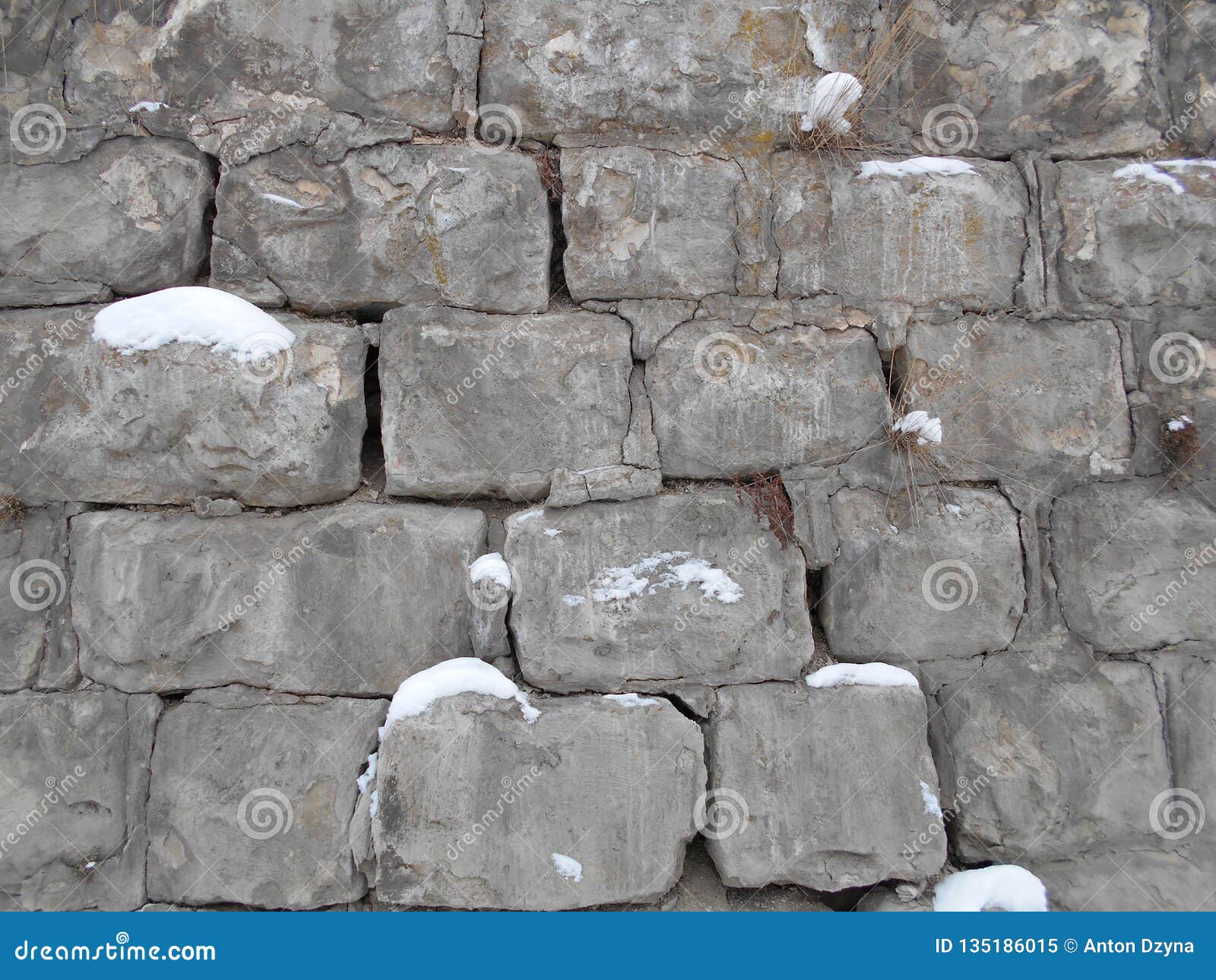 Broken Stone Wall in the Snow. Cement in the Winter in the Cold Stock ...