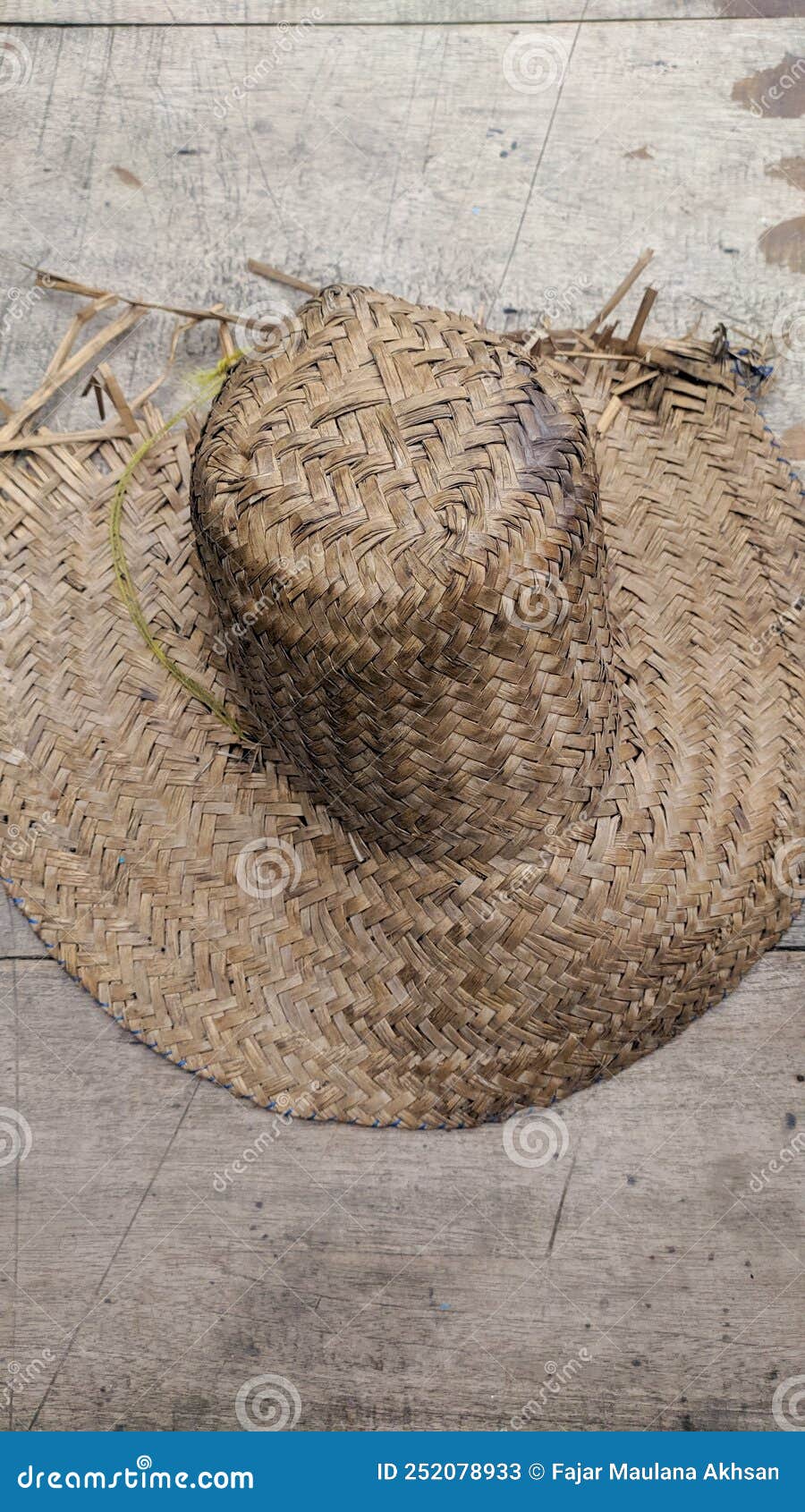 The Broken Straw Hat Next To it with a Potrait View Stock Image - Image ...