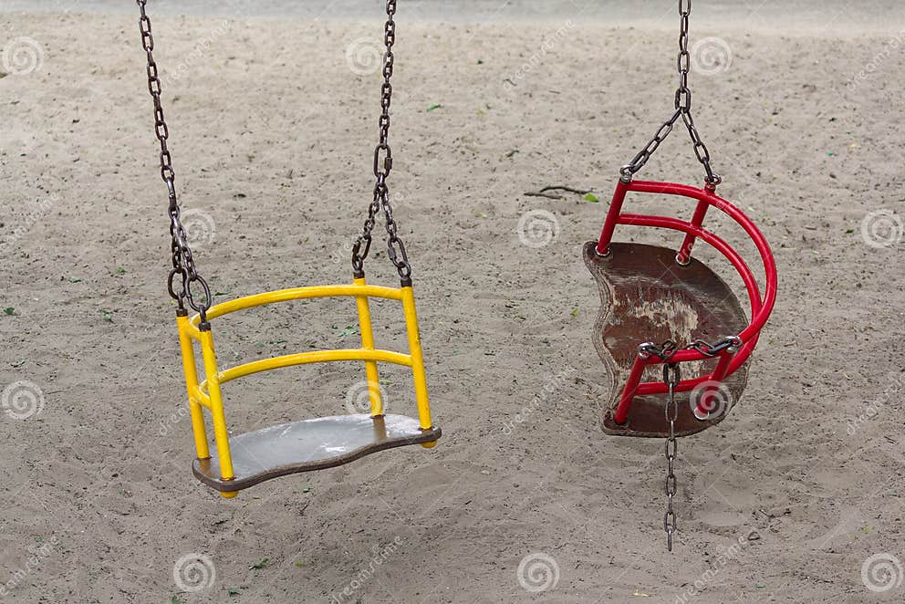 Broken Swing Hanging on the Playground Stock Photo - Image of dull ...