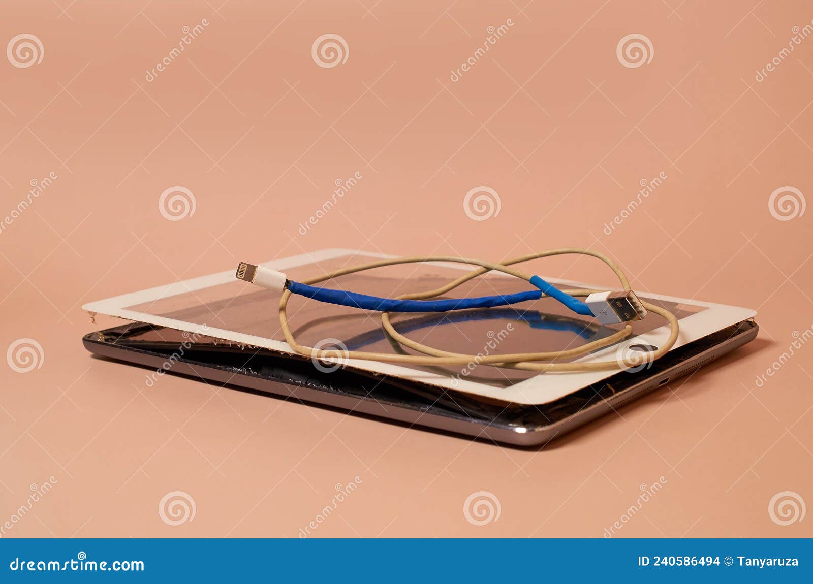 A Broken Tablet with a Swollen Battery and a Dirty Screen and a Bare ...