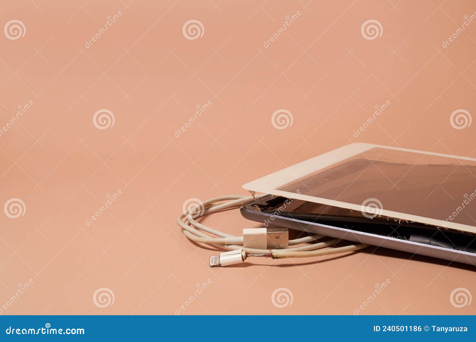 A Broken Tablet with a Swollen Battery and a Dirty Screen and a Bare ...