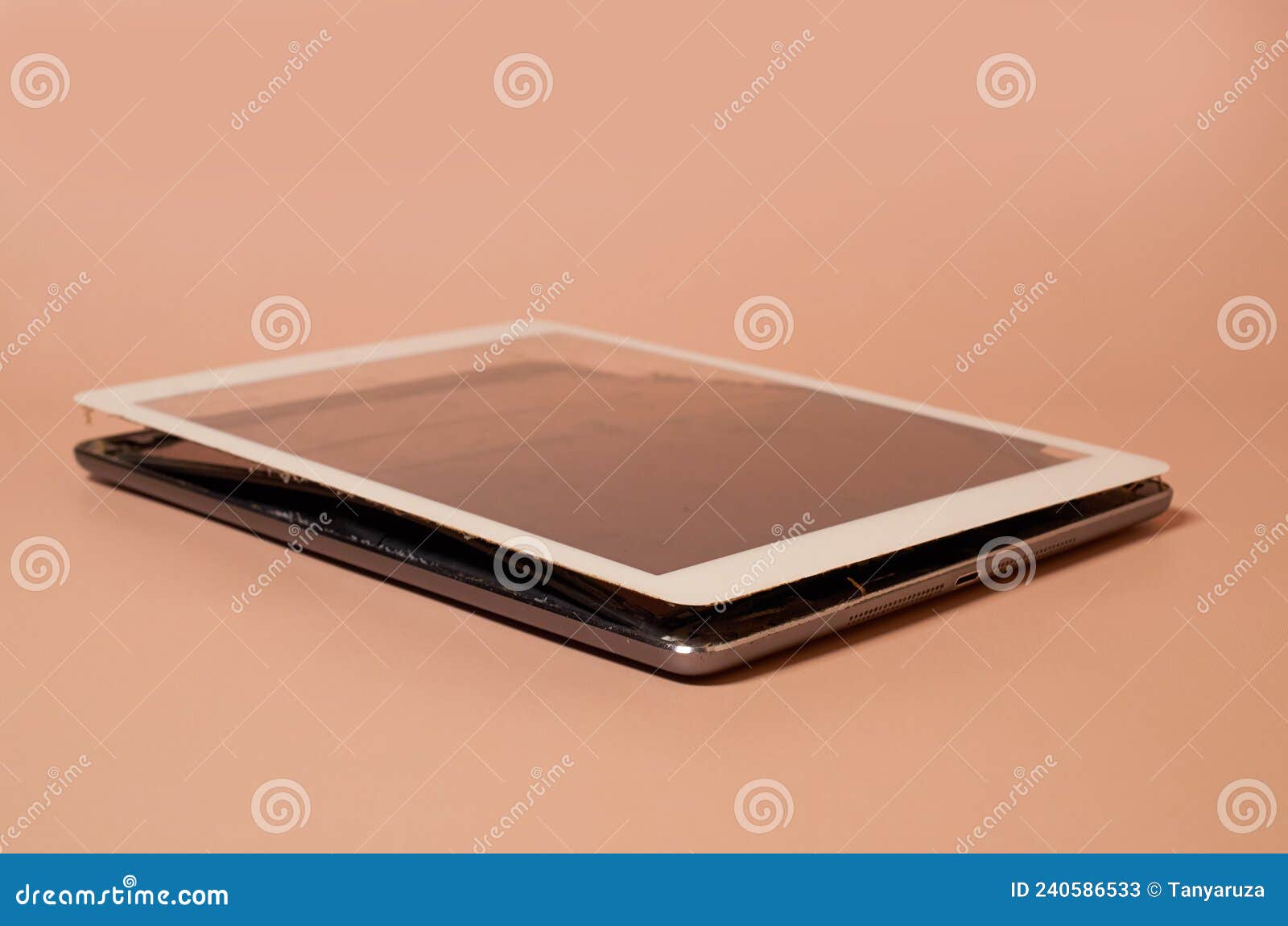 A Broken Tablet with a Swollen Battery and a Dirty Screen Stock Image ...