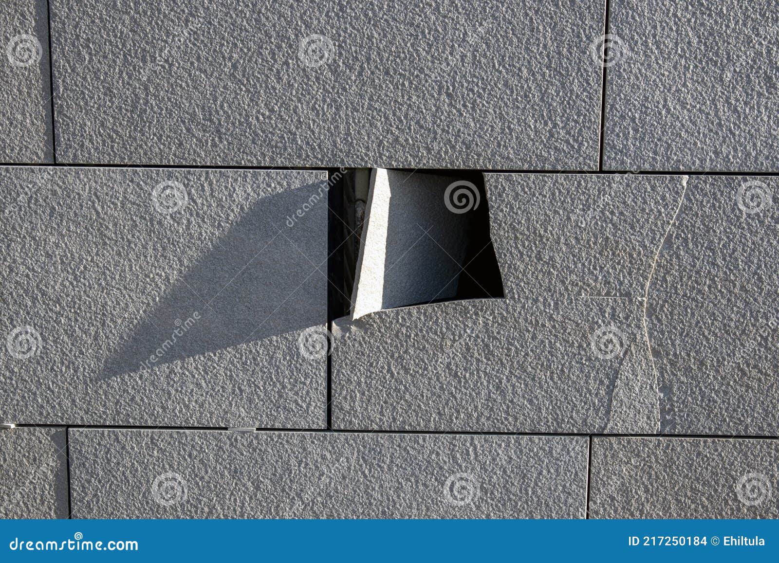 Broken tile on a wall stock photo. Image of damaged - 217250184