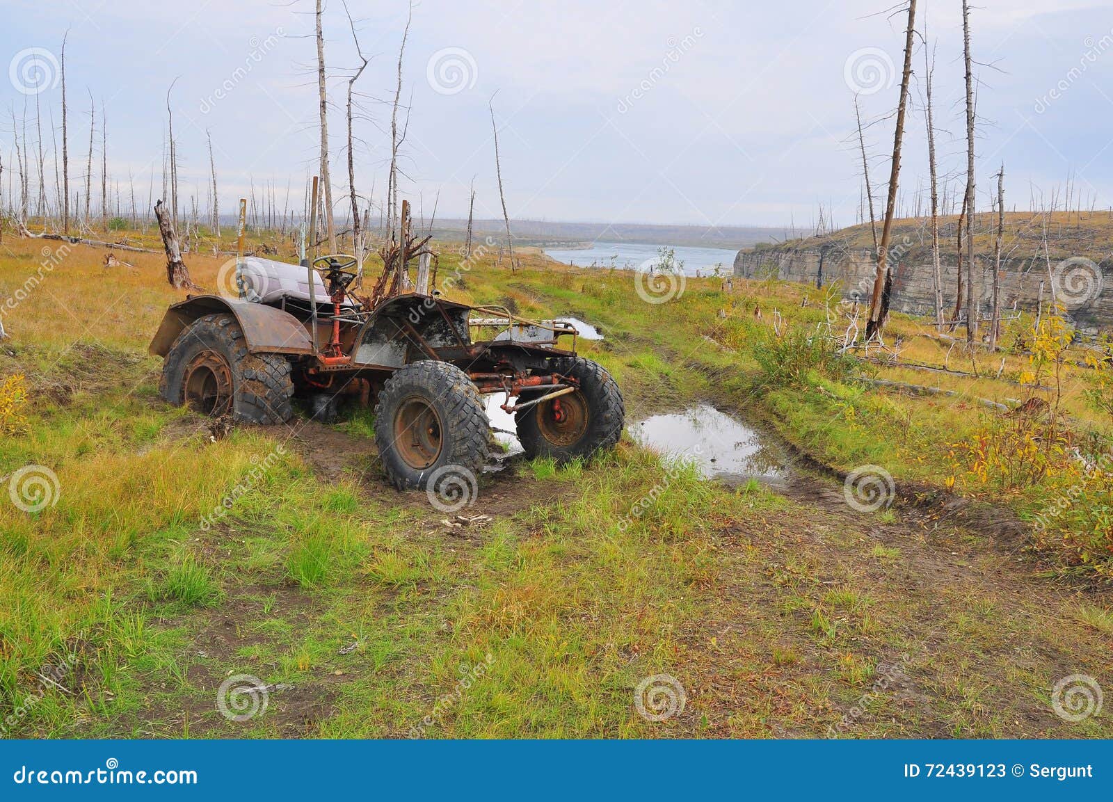 An Old Broken Tractor Stands Next To A House In The Village. Royalty ...