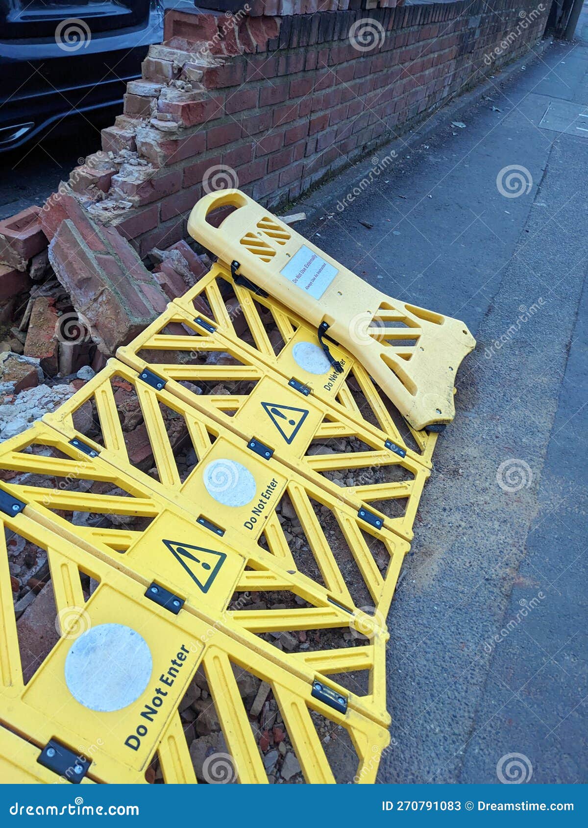 Broken Wall in a Carpark Been Hit by a Car with Warning Barrier Around ...