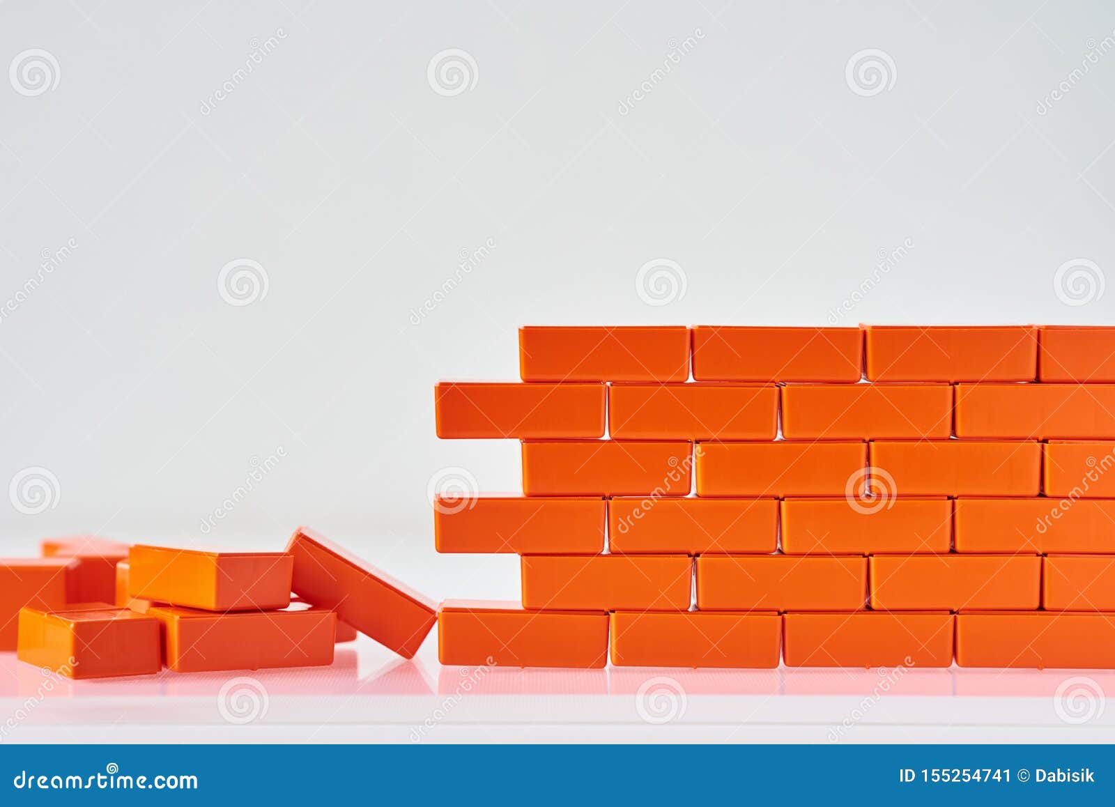 Broken Wall Made of Toy Blocks on a White Background Stock Image ...