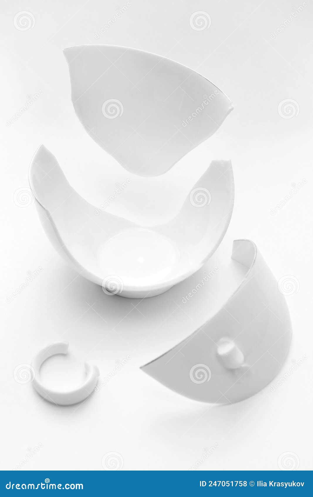 Broken White Cup on a White Background. Vertical. Concept of ...