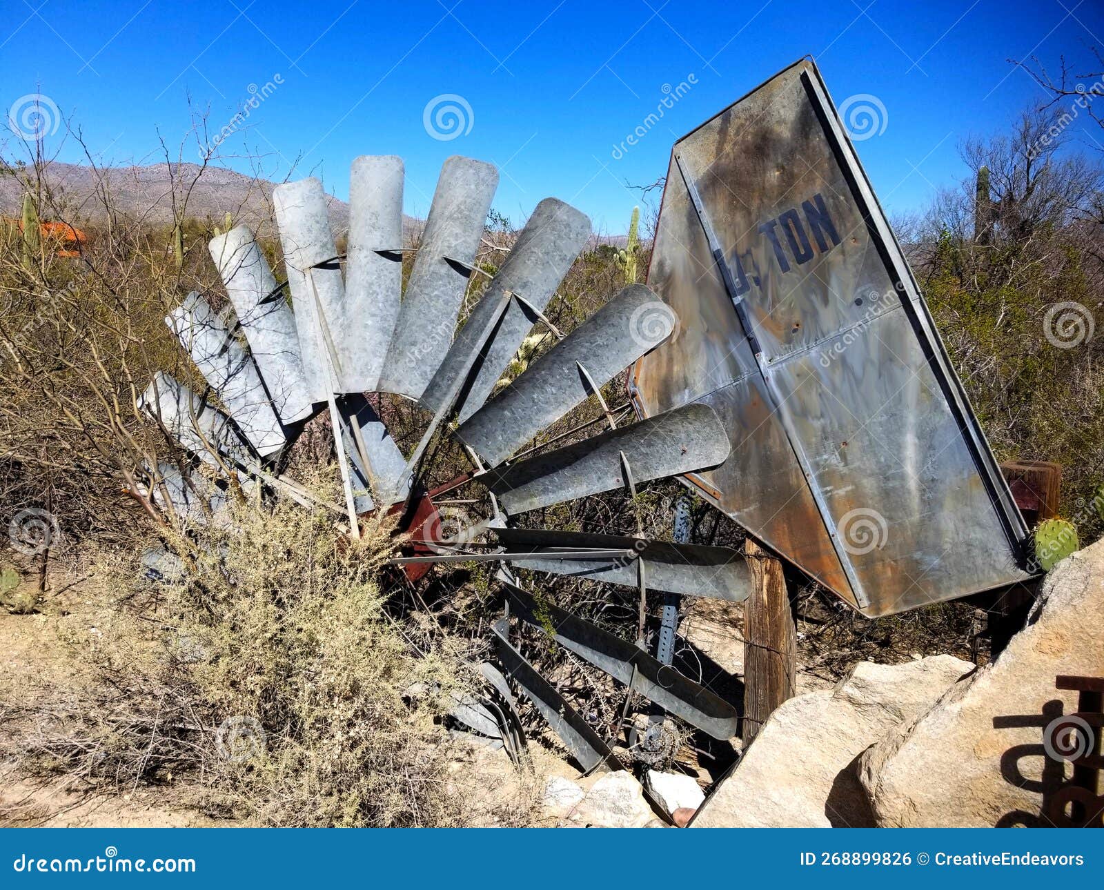 Broken Windmill Top Section Lying on Ground Stock Photo - Image of ...