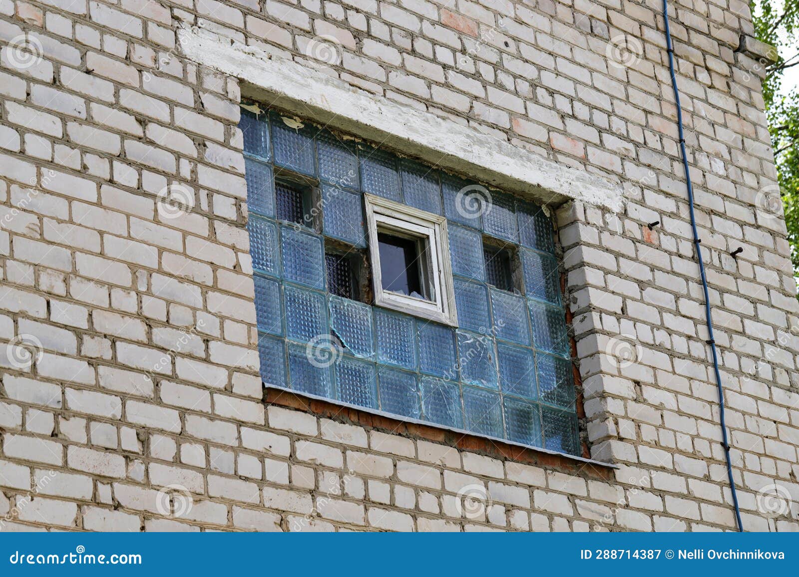 A Broken Window Made of Glass Blocks in a Brick Wall Stock Image ...
