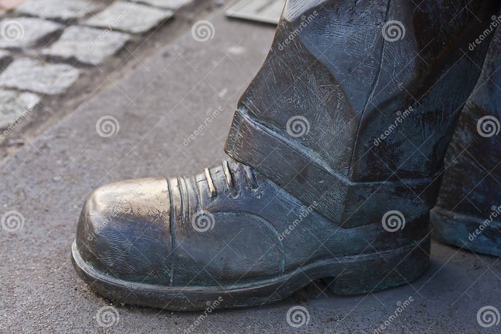 Bronze Boot Statue Detail stock photo. Image of coal - 46830536