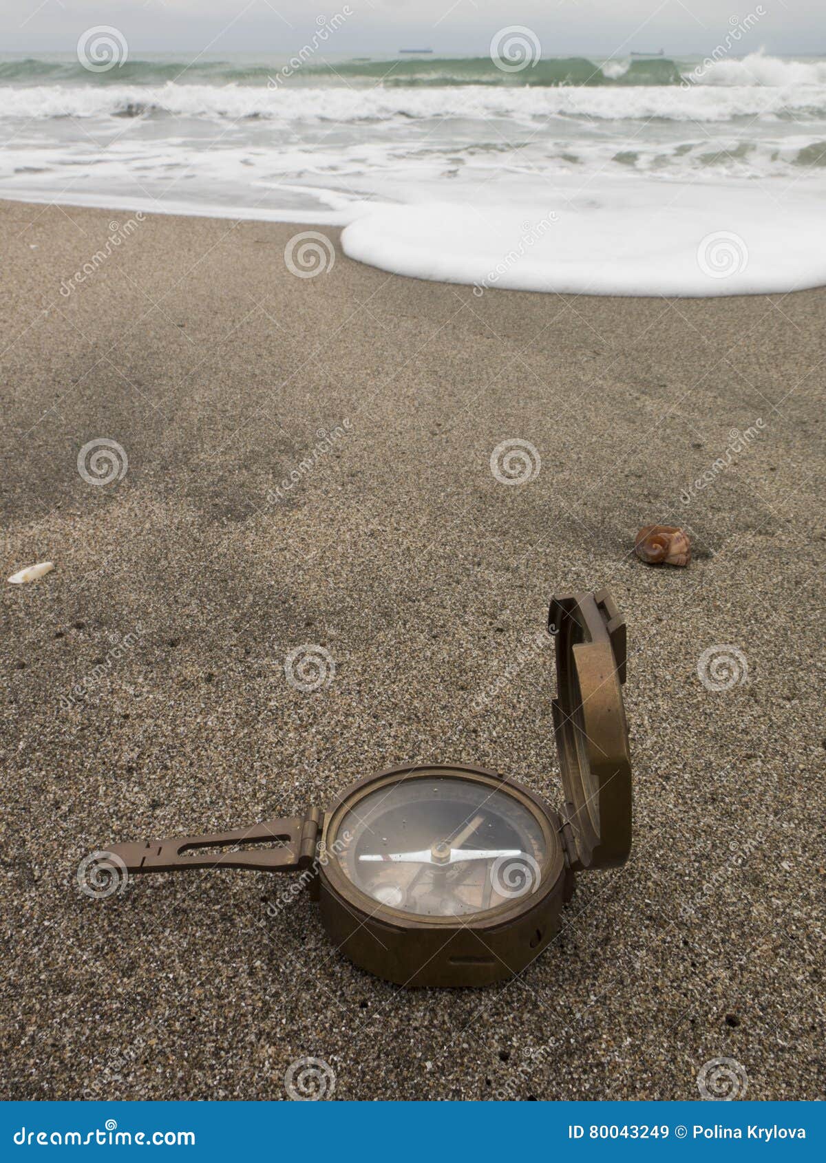 Bronze Compass on the Beach on Sea Background Stock Image - Image of ...