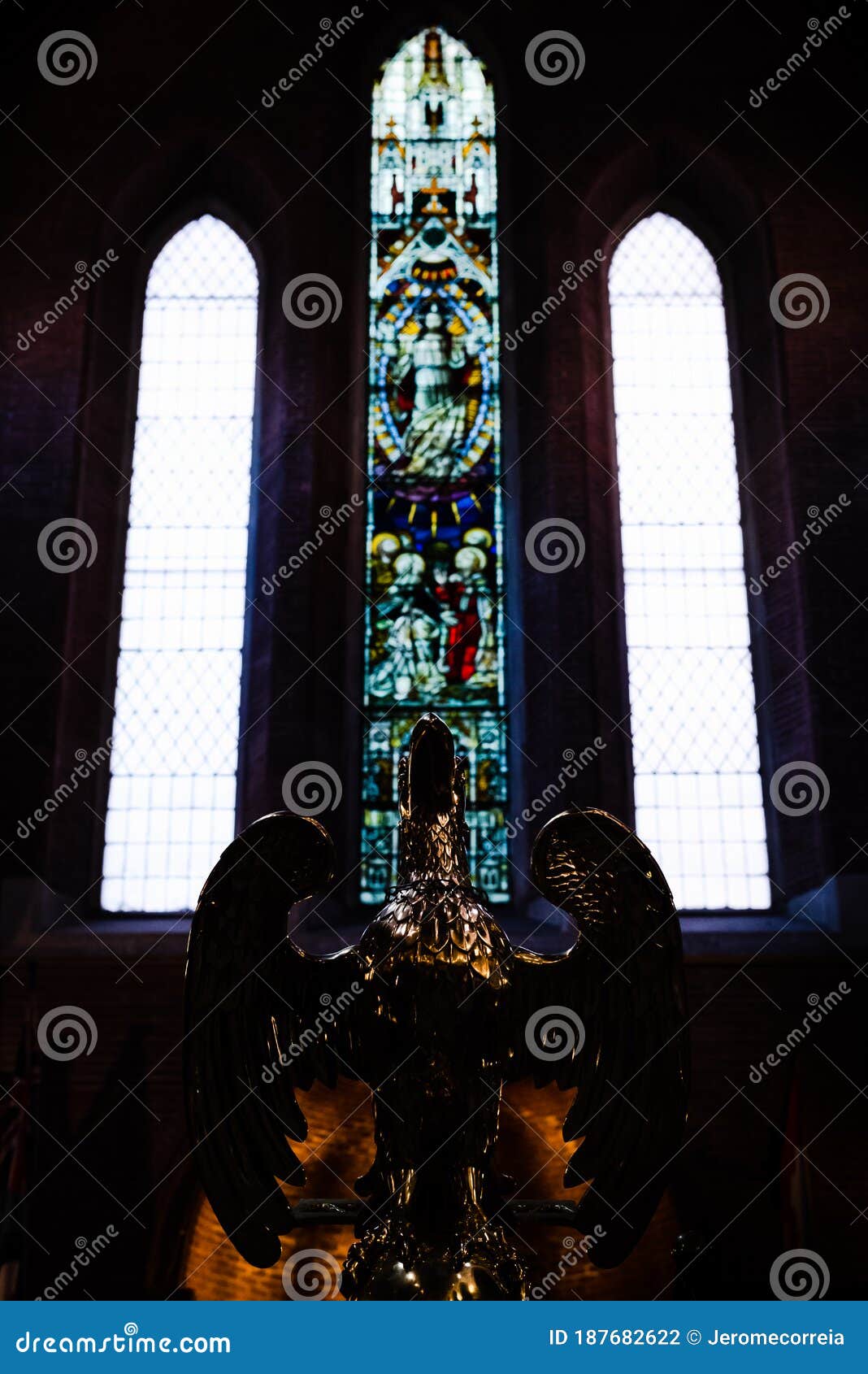 Bronze Eagle Statue in Front of Stained Glass Windows Inside a Church ...