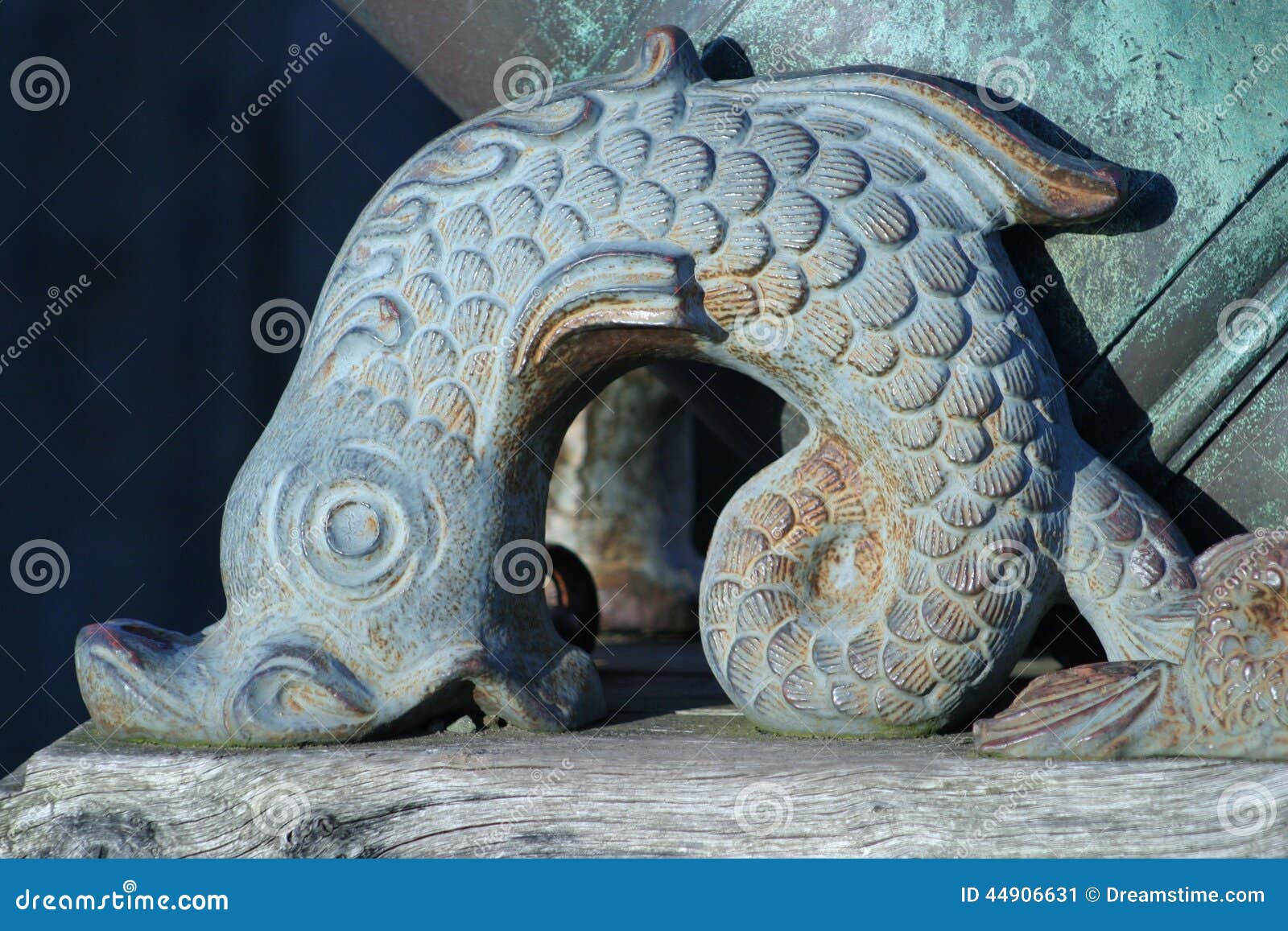 Bronze Fish At A Fountain Spitting Water Stock Photography ...