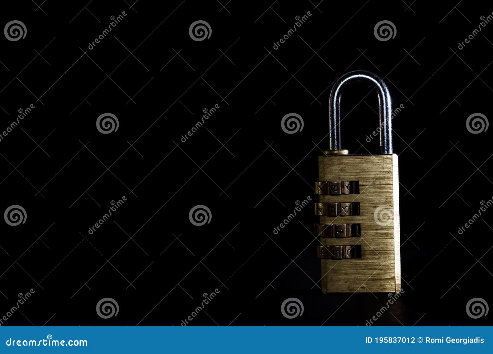 Bronze Numeric Lock on Black Background Stock Photo - Image of copy ...