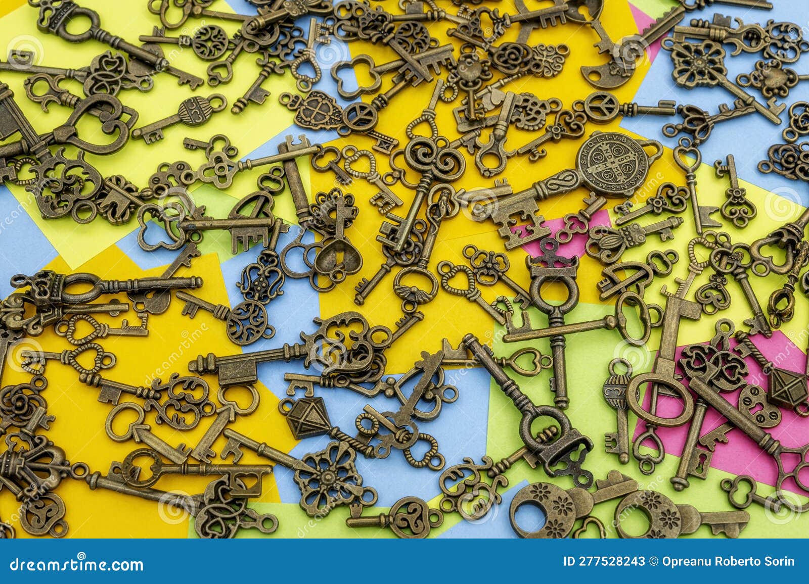 Bronze Ornamental Keys on a Background of Multicolored Paper Sticky ...