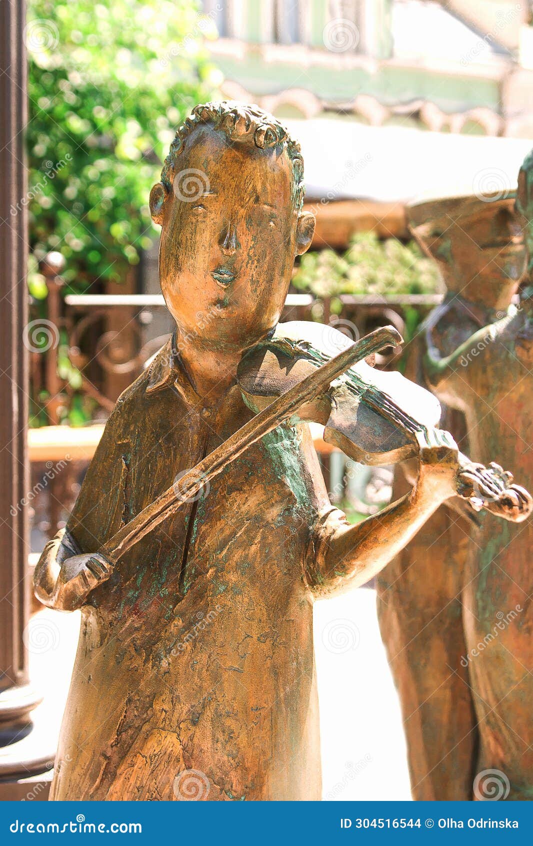 Bronze Statue of a Boy on the Street Stock Photo - Image of wood ...
