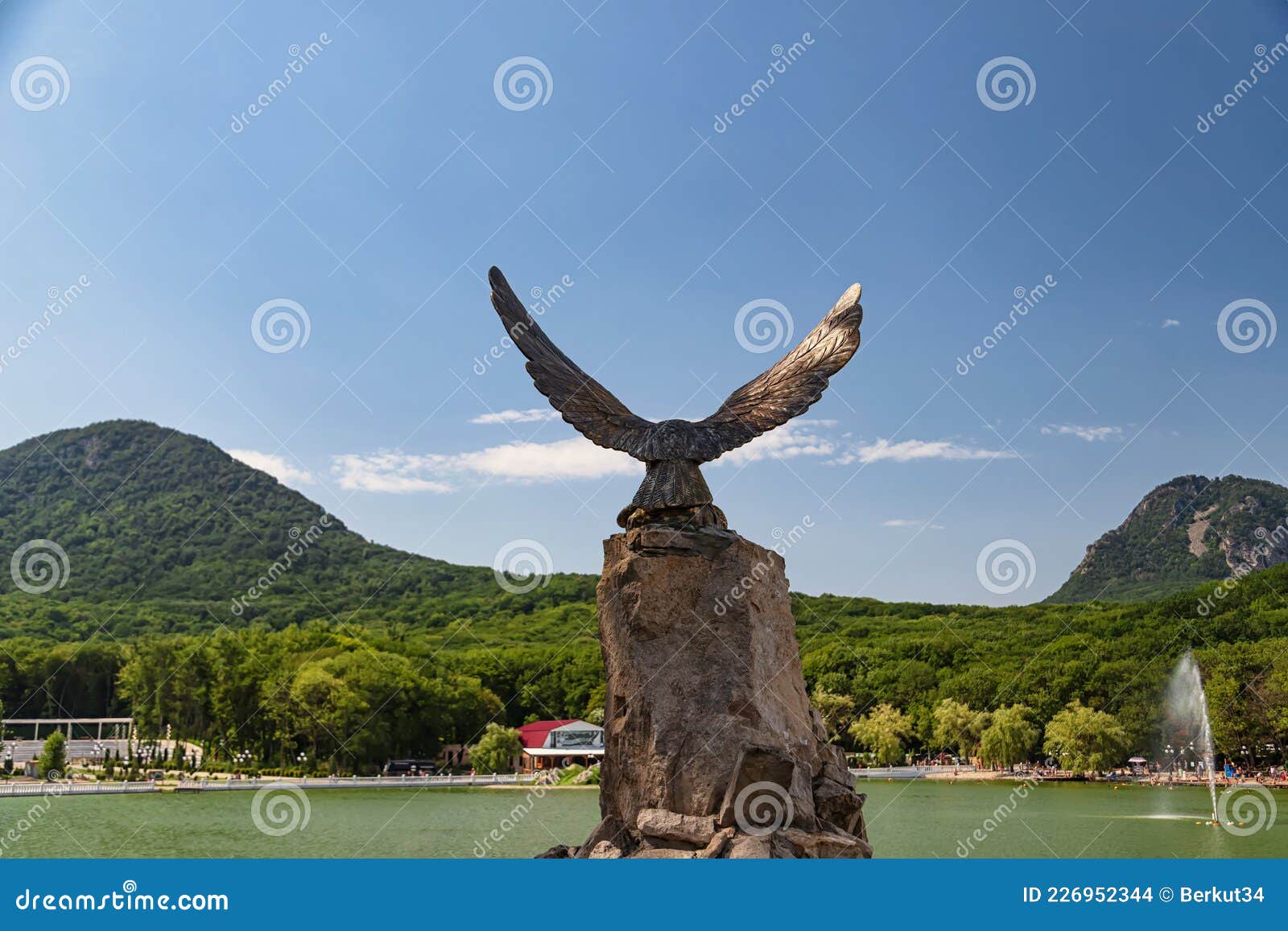 Bronze Statue of the Eagle on Background of Mountains Stock Photo ...