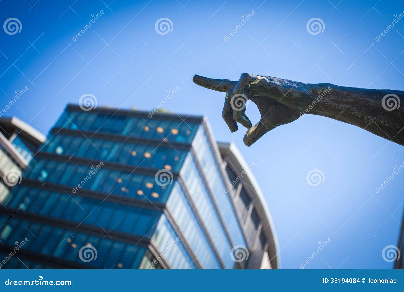 Bronze Statue Pointing Finger Stock Photo - Image of glass, facade ...