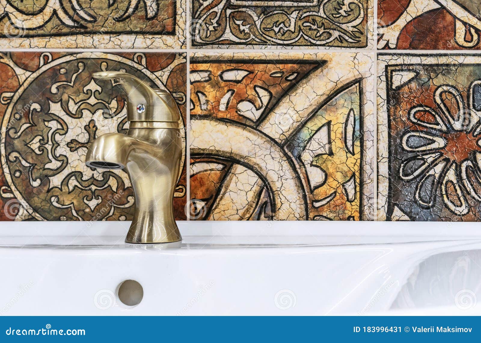 Bronze Water Tap on a Background of Bright Ceramic Tiles with Cracks ...