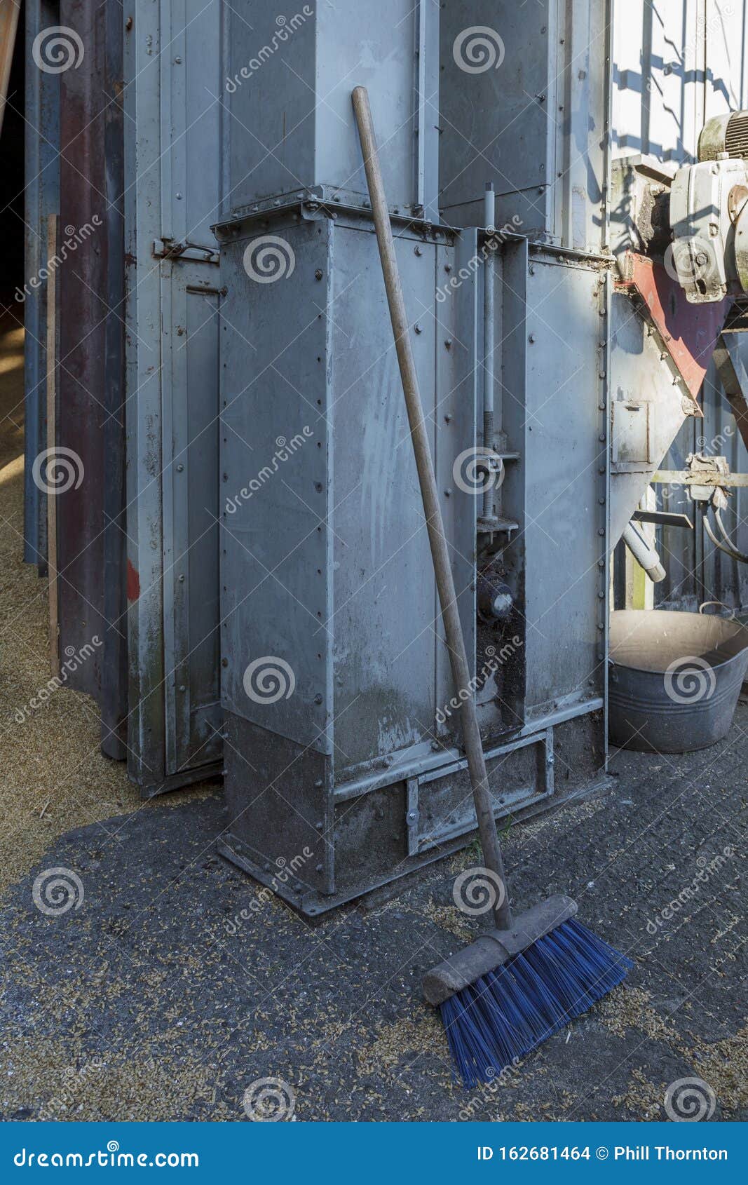Broom Leaning Against an Industrial Grain Storage Building Stock Photo ...