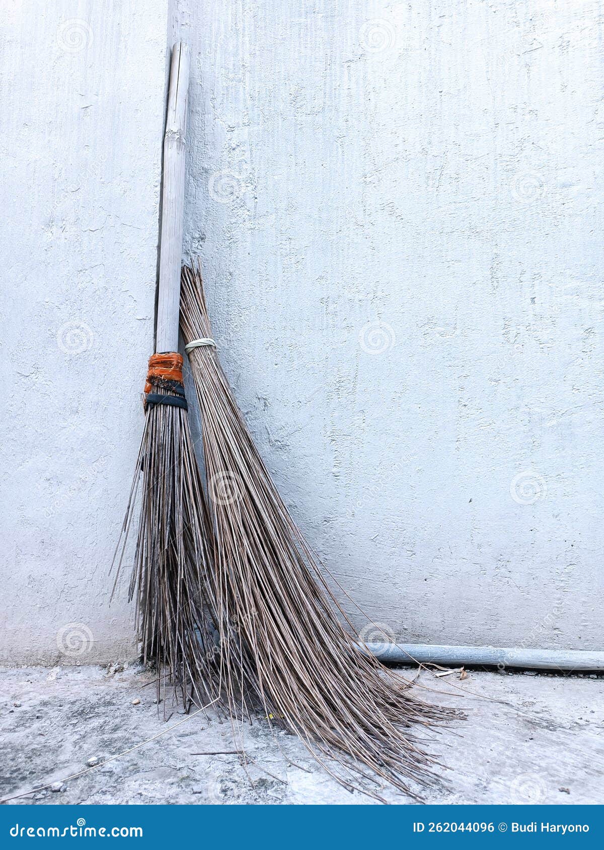 Broom Stick Leaning Against the Fence Wall Stock Photo - Image of wall ...