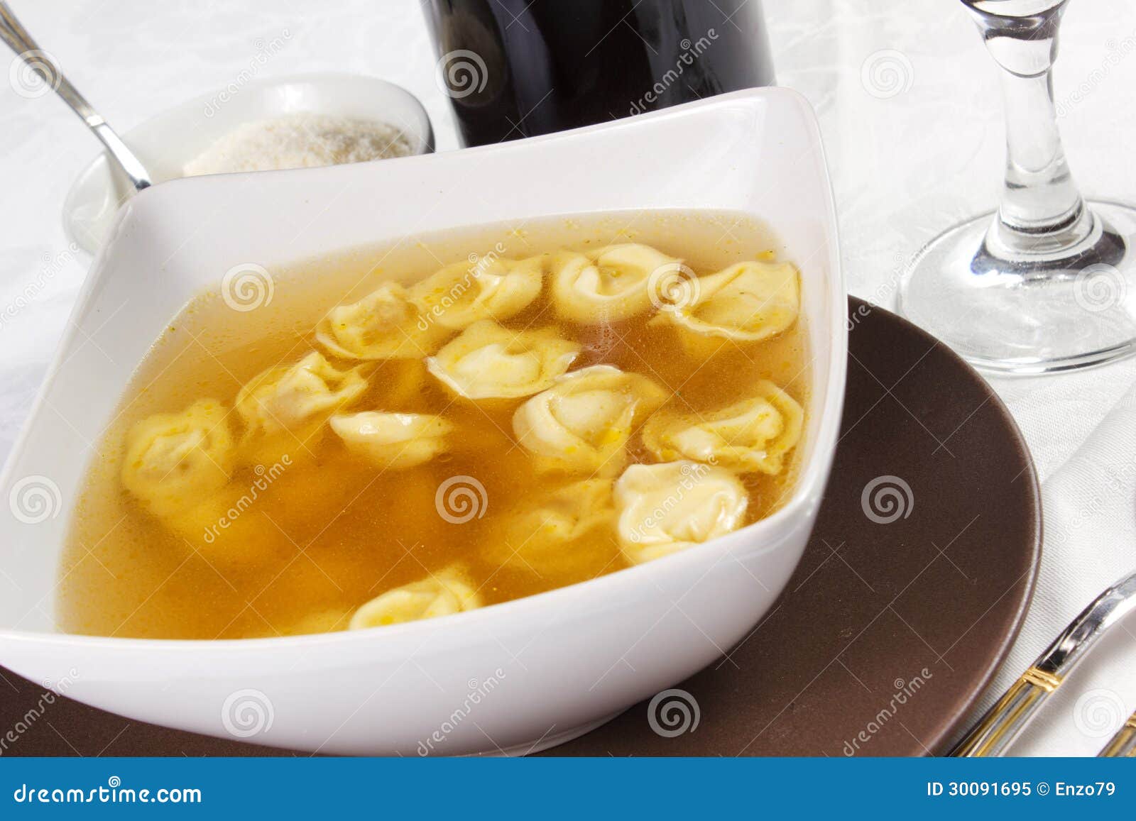 Broth with ravioli stock image. Image of table, setting - 30091695